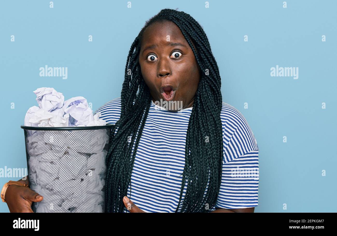 Woman holding papers shocked hi-res stock photography and images - Alamy