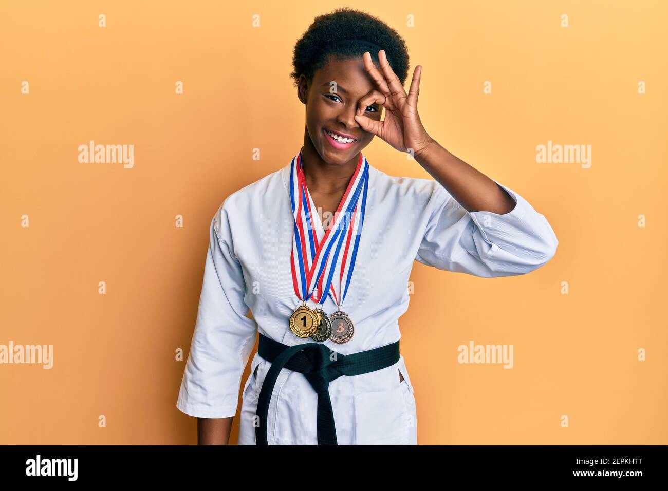 Young african american girl wearing karate kimono and black belt ...