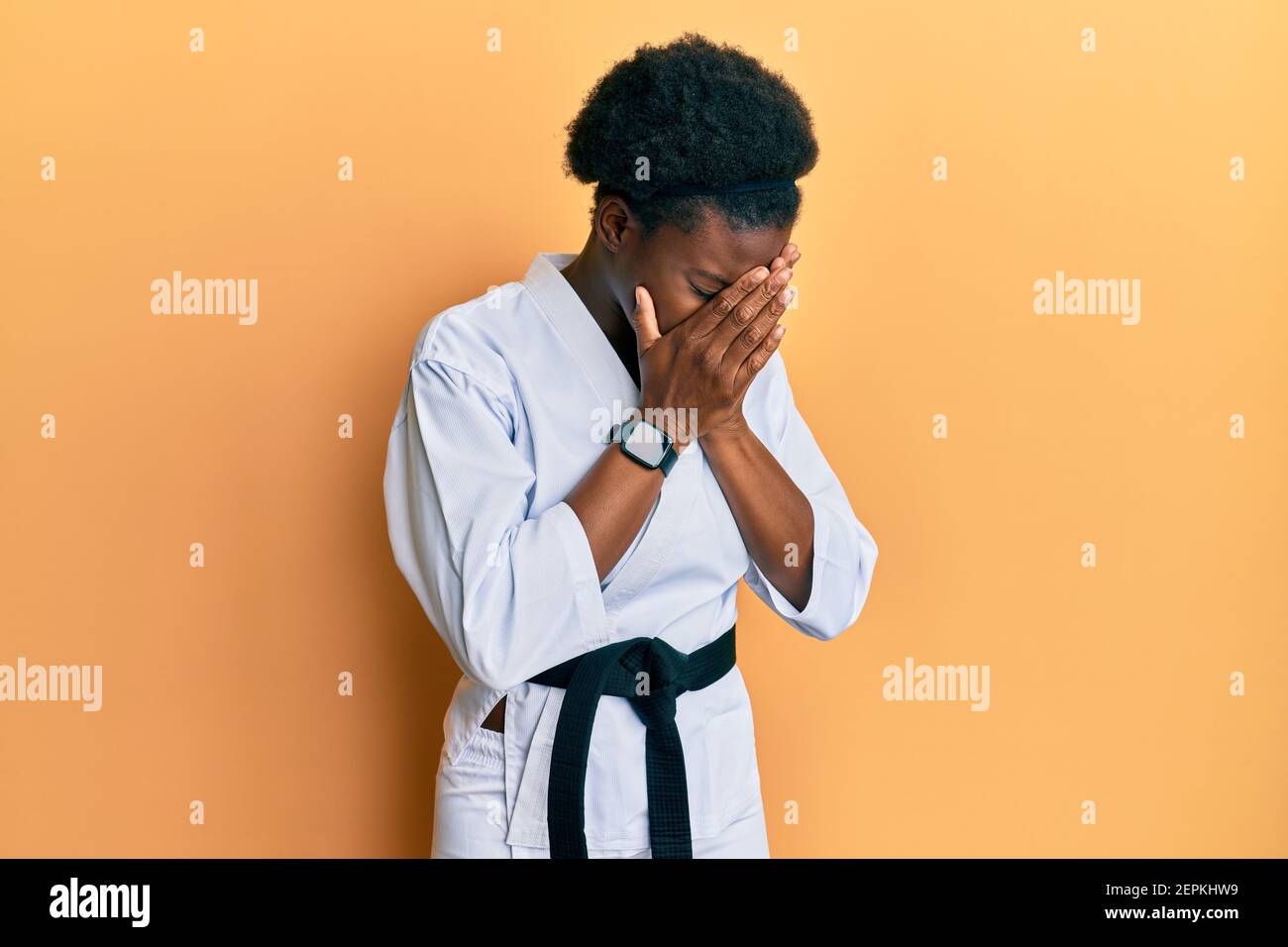 Young african american girl wearing karate kimono and black belt with ...