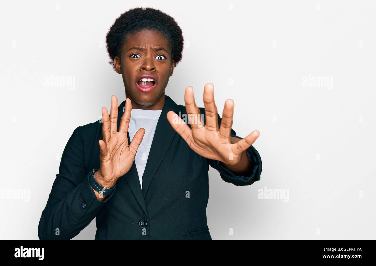 Young african american girl wearing business clothes afraid and ...