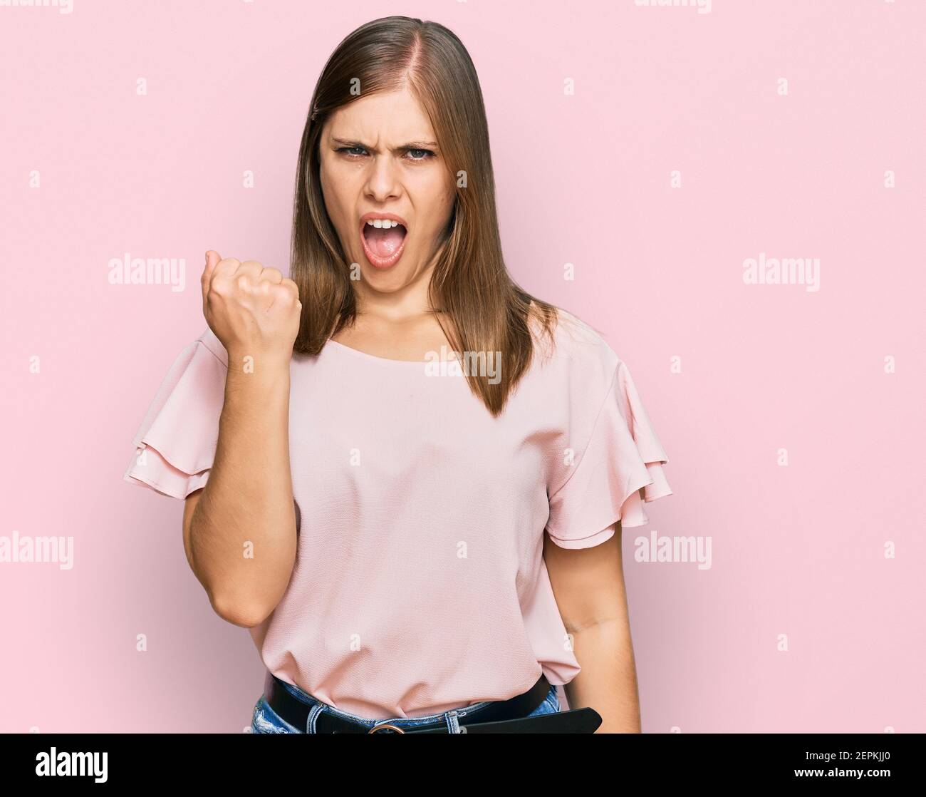 Woman raising hand upset hi-res stock photography and images - Alamy