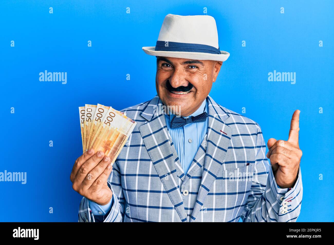 Mature middle east man with mustache wearing elegant vintage style ...