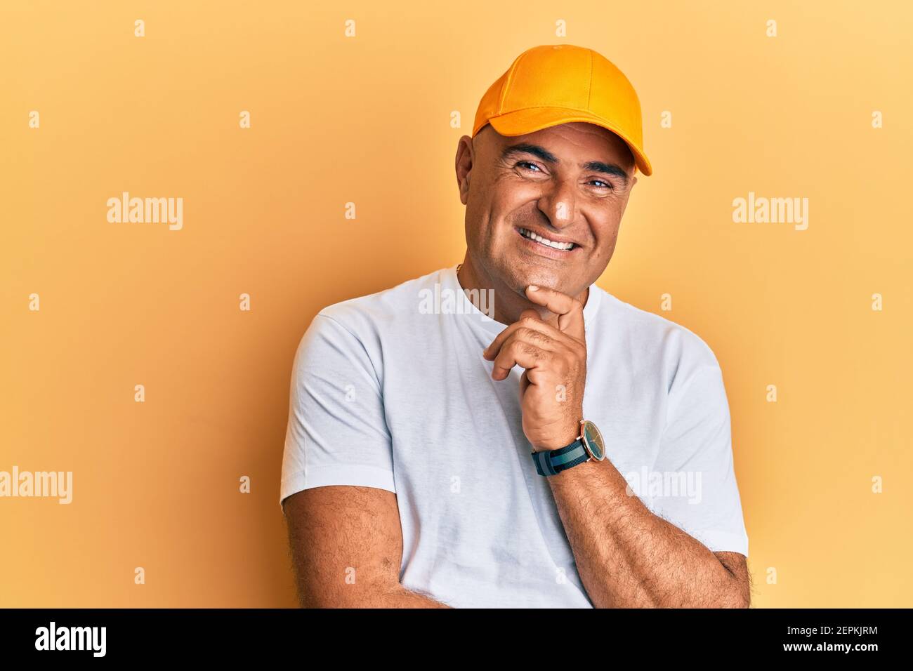 Mature middle east man with mustache wearing casual white tshirt and ...