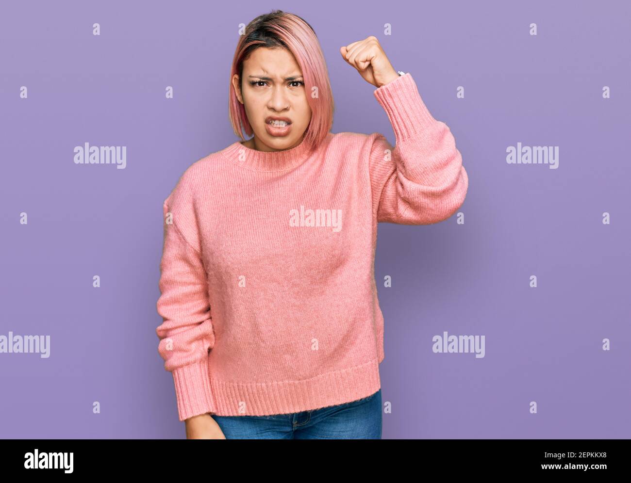 Girl in pink raising hand hi-res stock photography and images - Alamy
