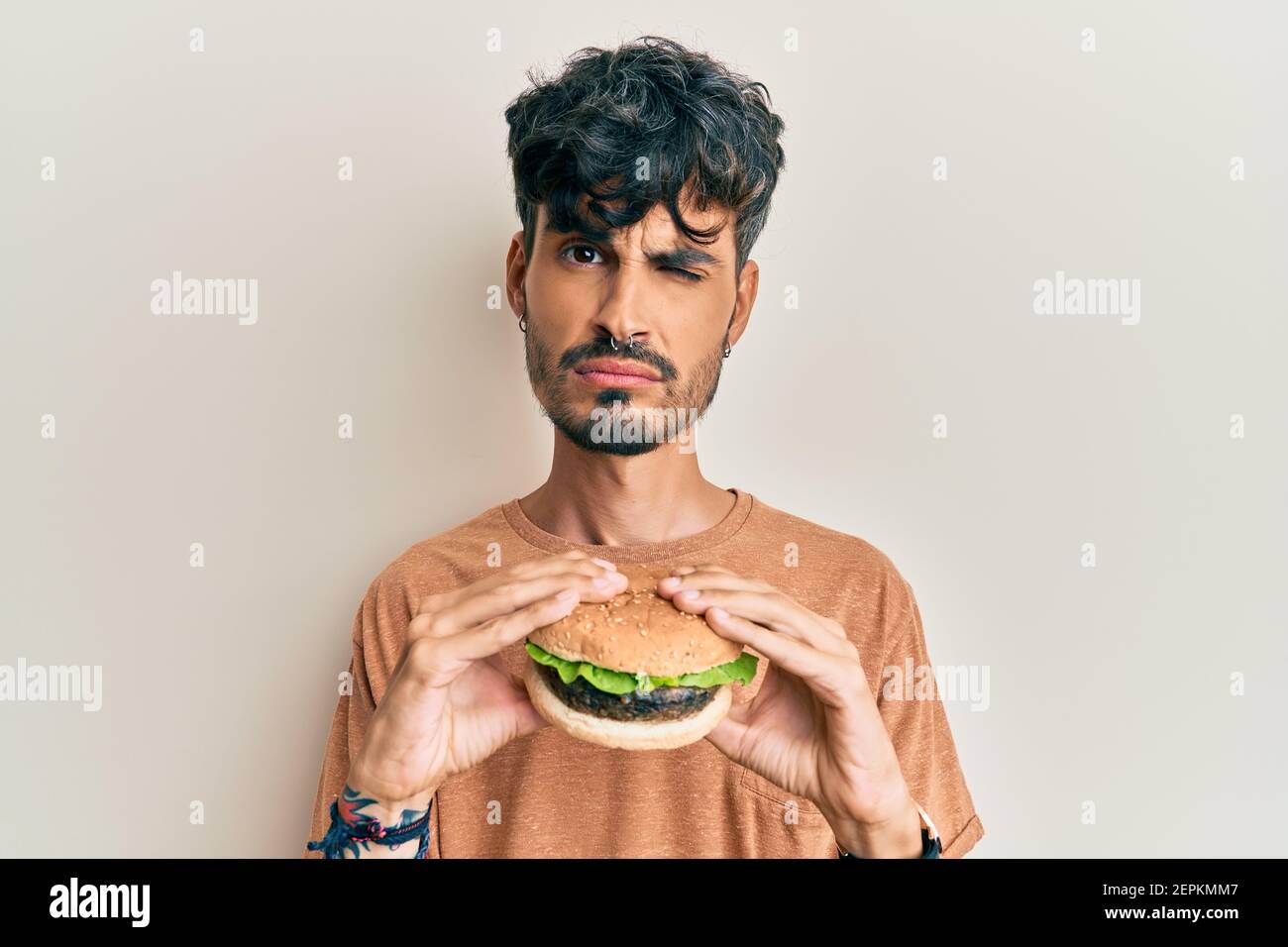 Nervous person eating hamburger hi-res stock photography and images - Alamy