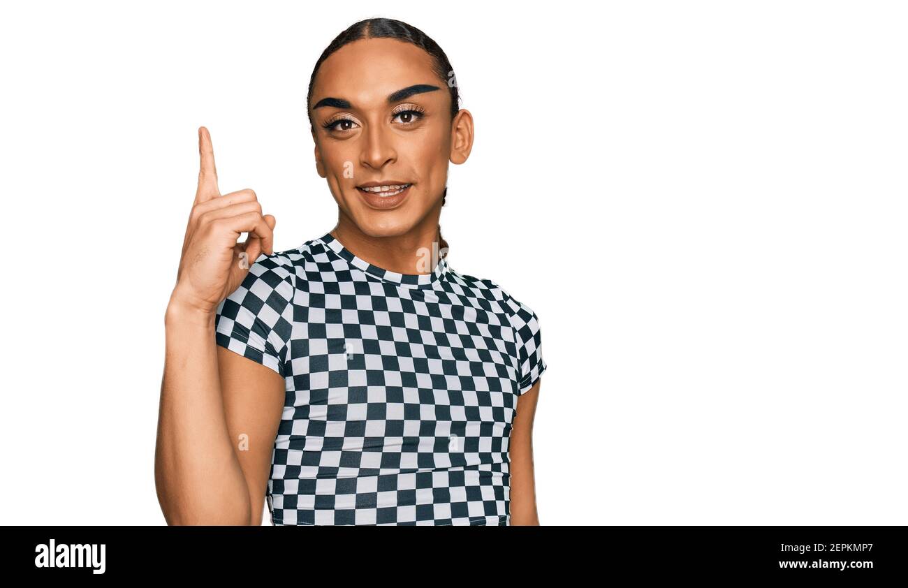 Hispanic transgender man wearing make up and long hair wearing modern ...