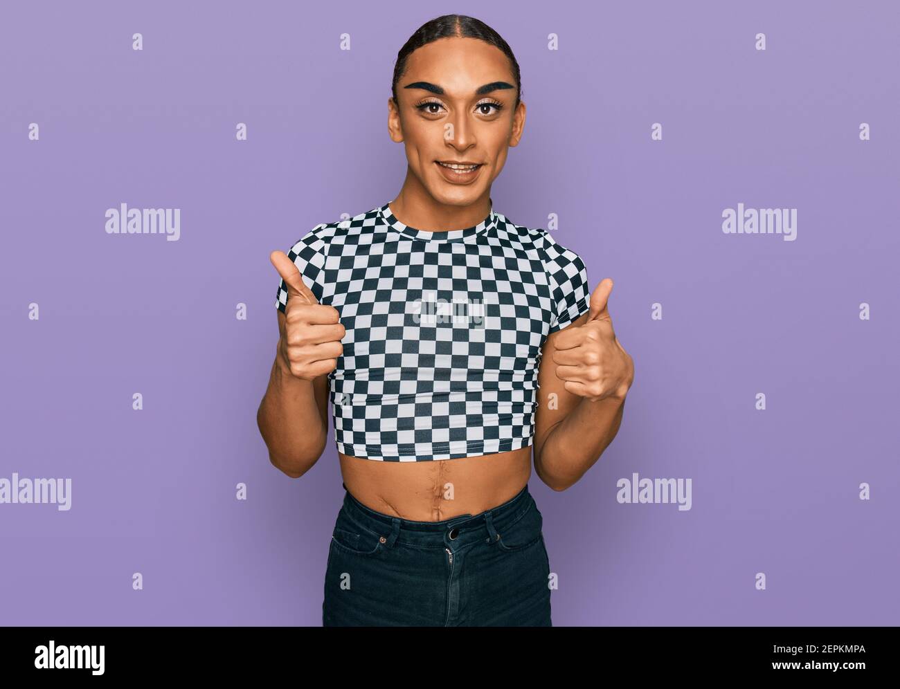 Hispanic transgender man wearing make up and long hair wearing modern ...