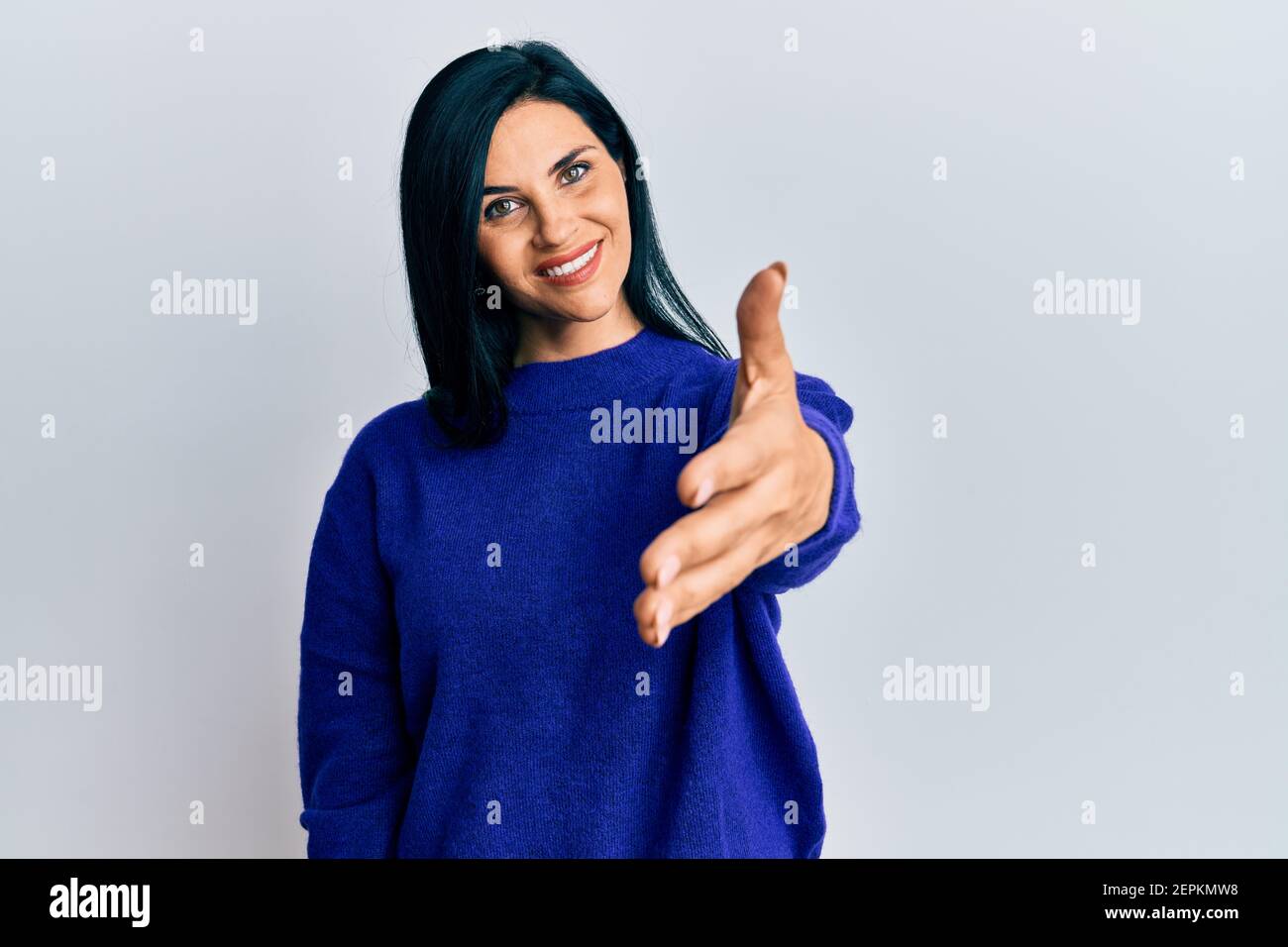 Young caucasian woman wearing casual clothes smiling friendly offering ...