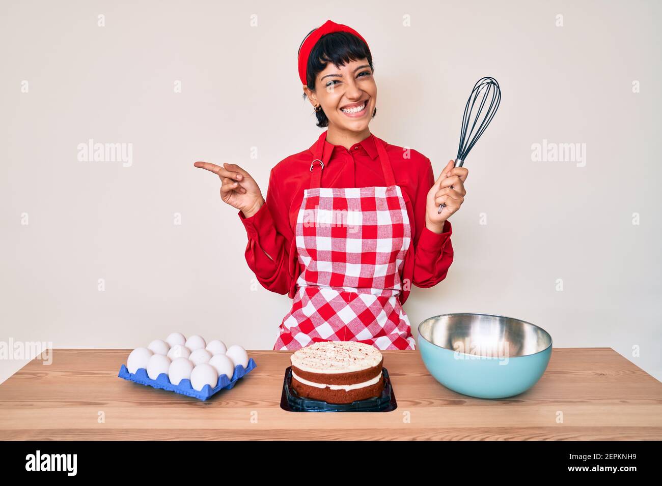 Beautiful cook using whisk hi-res stock photography and images - Alamy