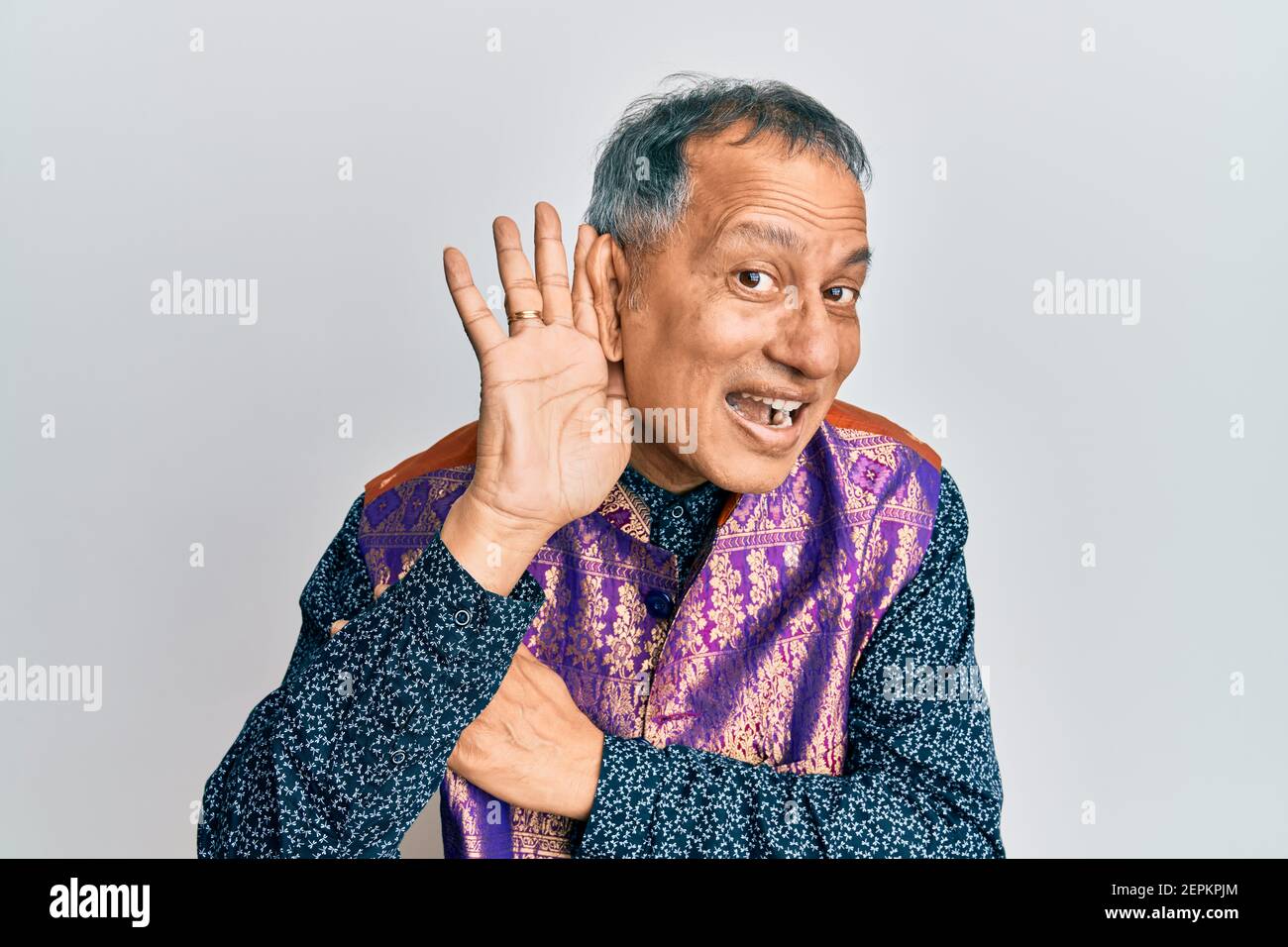 Middle age indian man wearing traditional indian clothes smiling with ...