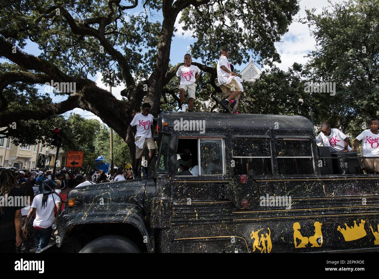 Kids dance atop a car during a vibrant second line parade in the Treme ...