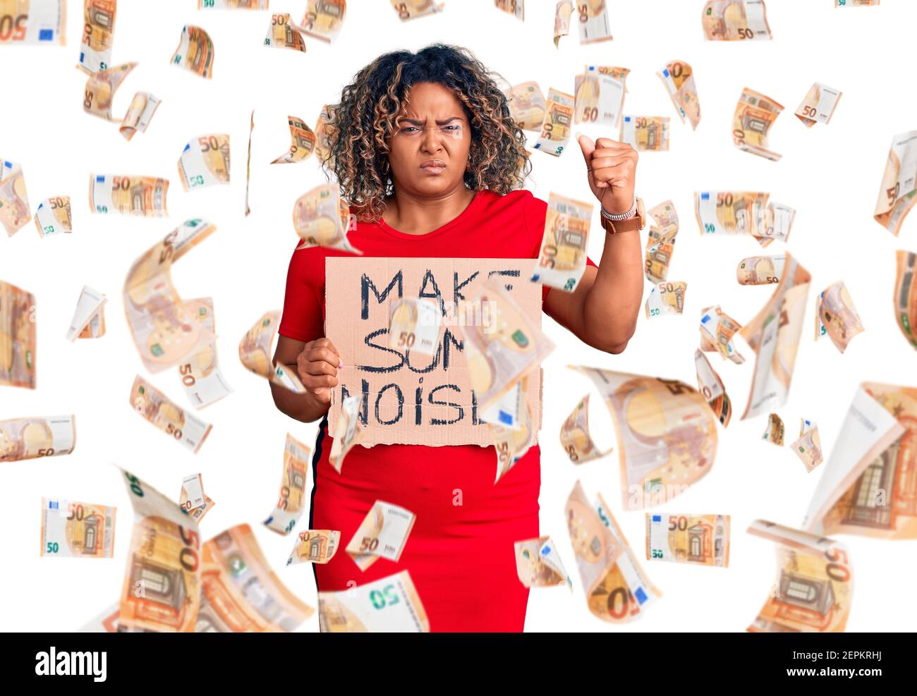 Young african american plus size woman holding make some noise banner ...