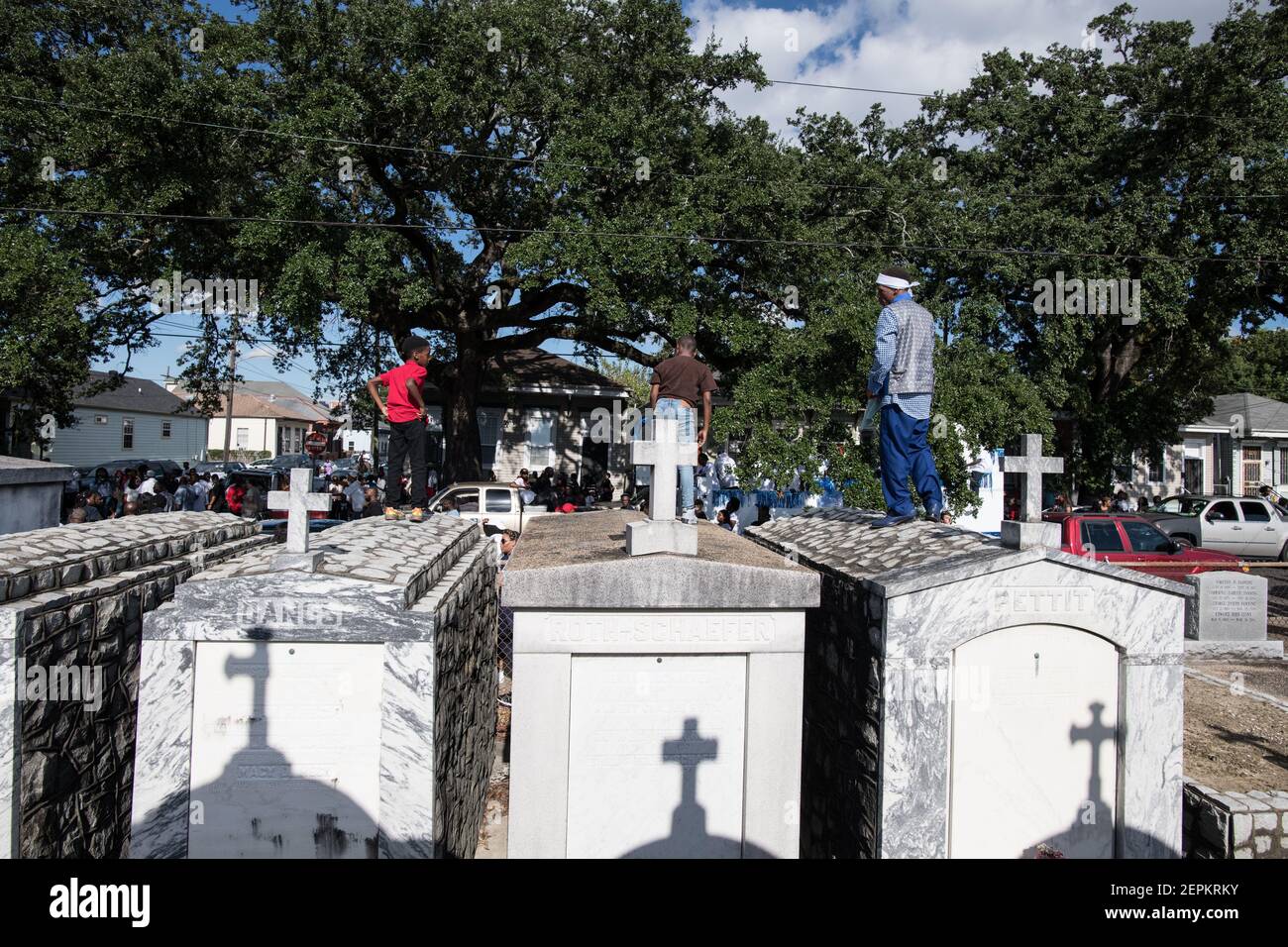 Young men dancing on graves and tombs in cemetery during Prince of ...