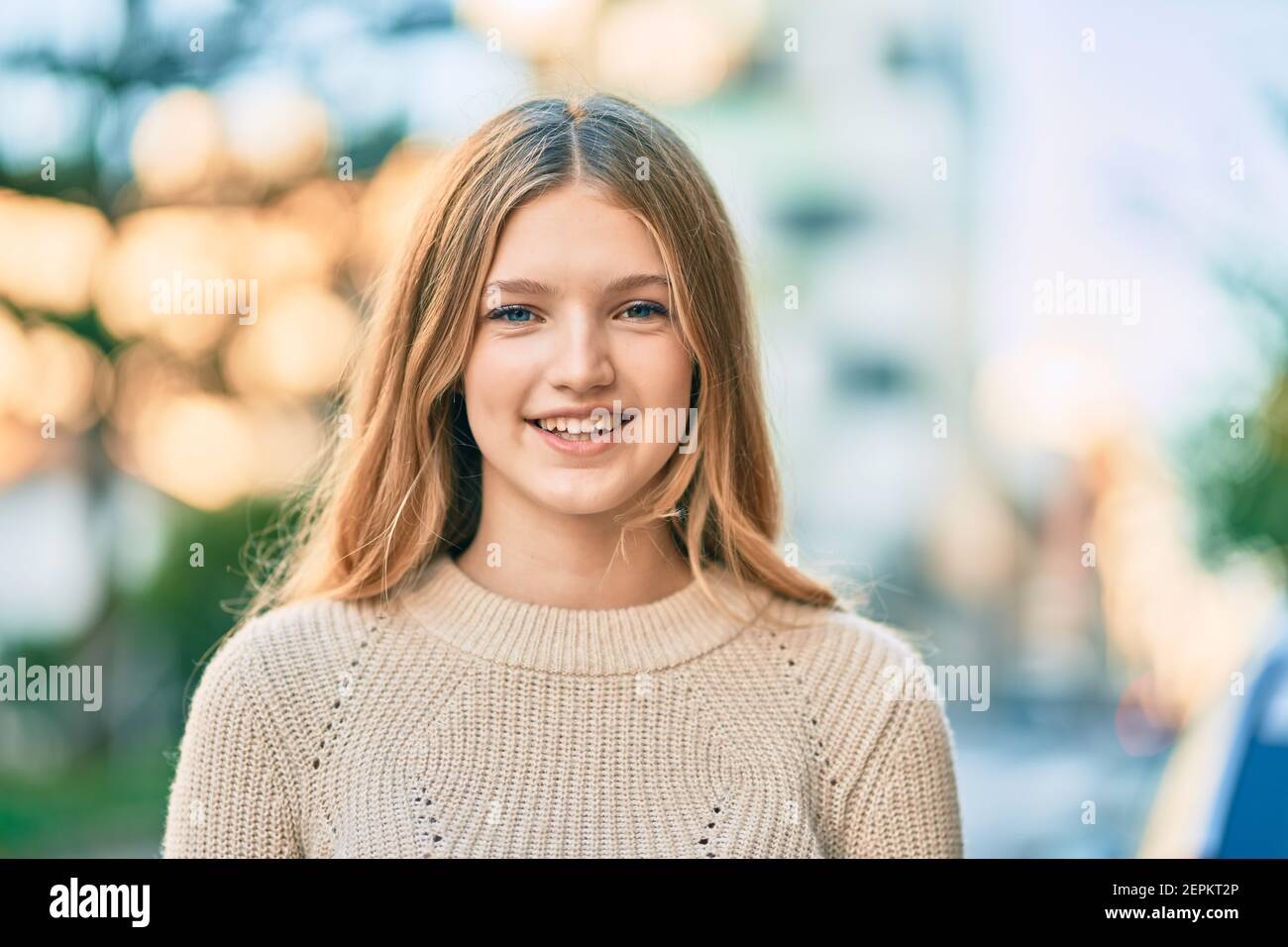 Beautiful caucasian teenager smiling happy standing at the city Stock ...