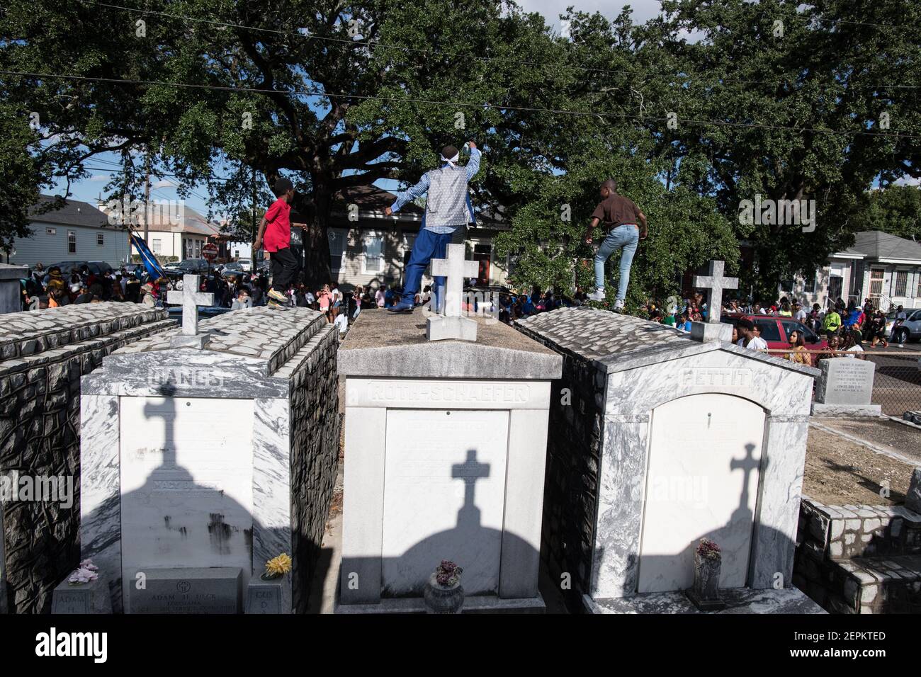 Young men dancing on graves and tombs in cemetery during Prince of ...