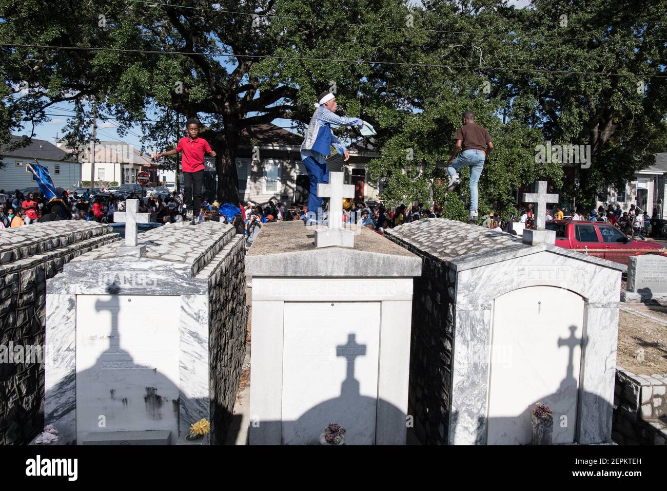 Young men dancing on graves and tombs in cemetery during Prince of ...