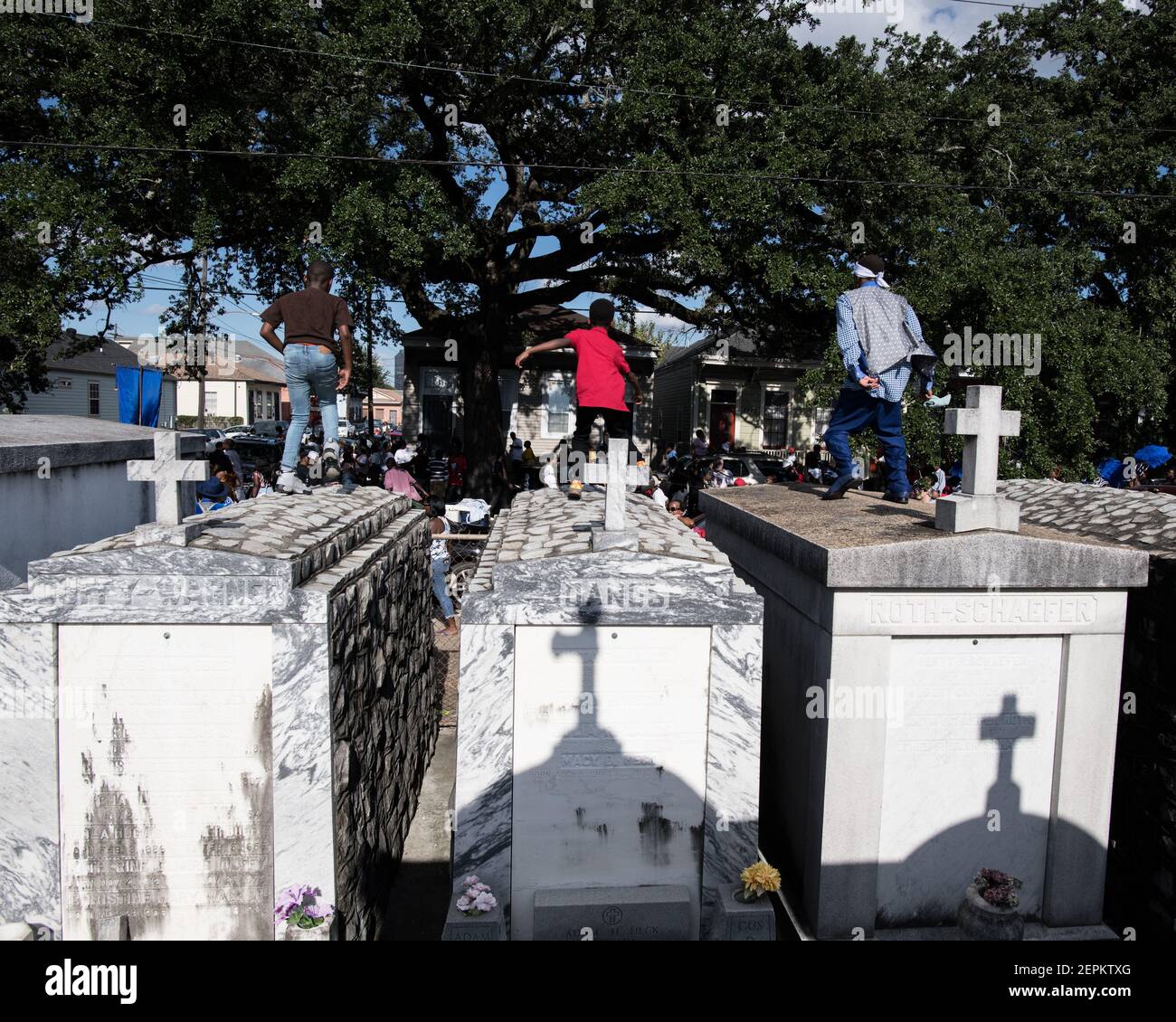 Young men dancing on graves and tombs in cemetery during Prince of ...