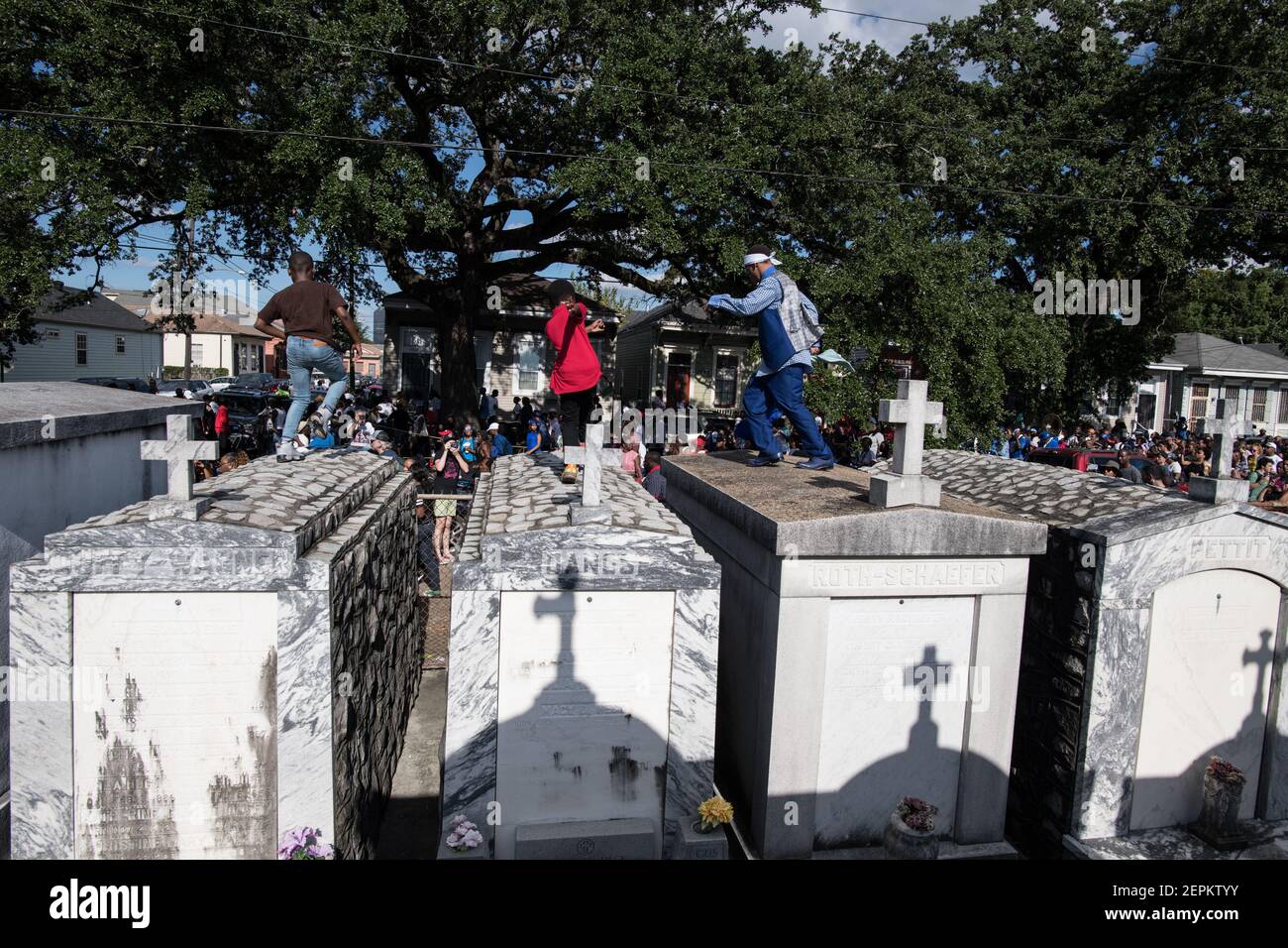 Young men dancing on graves and tombs in cemetery during Prince of ...