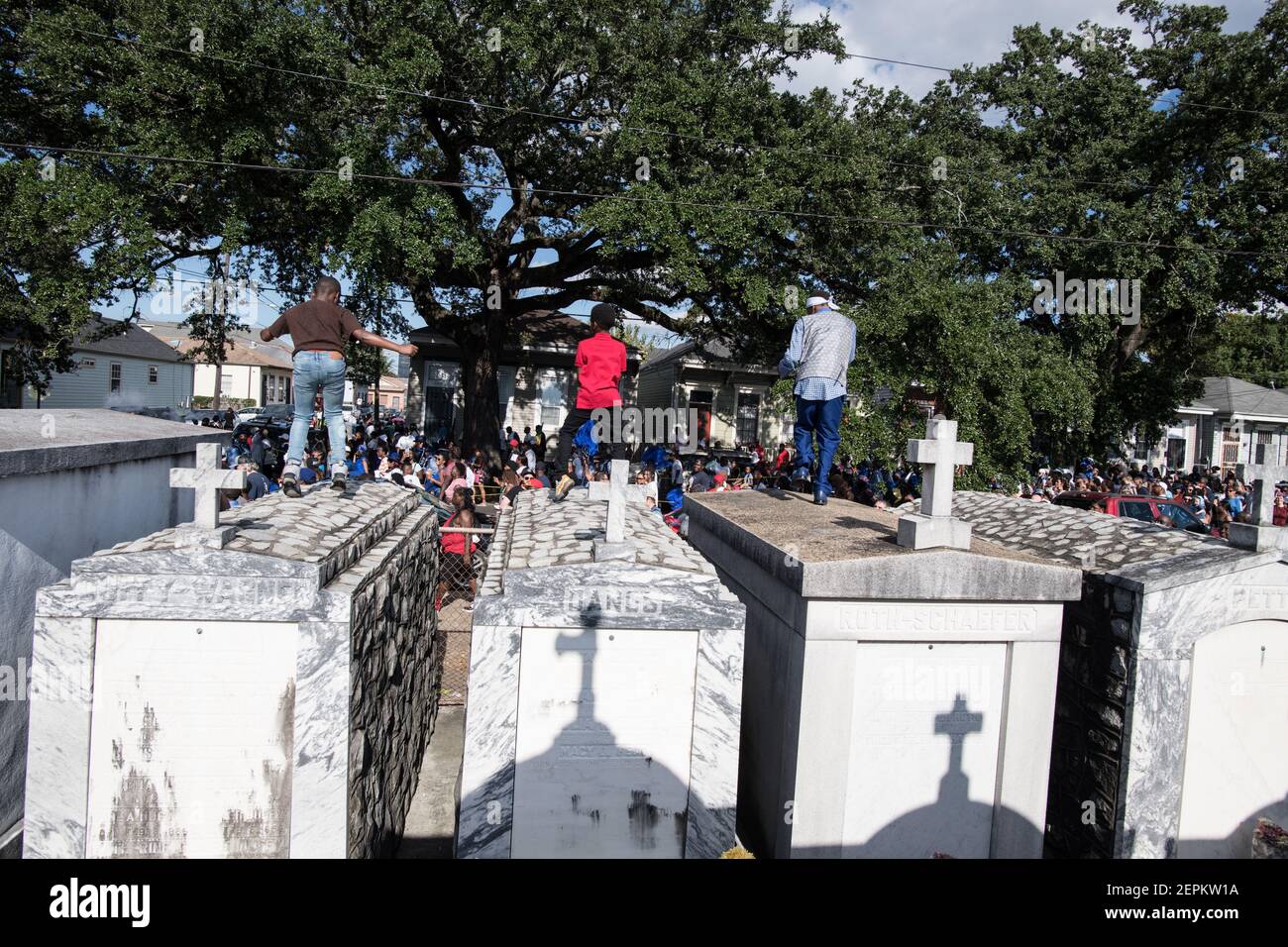 Young men dancing on graves and tombs in cemetery during Prince of ...