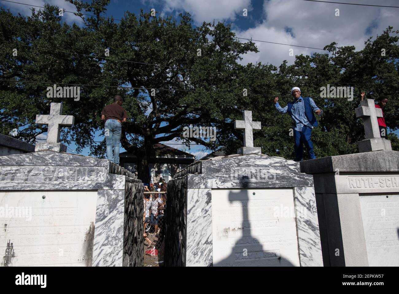 Young men dancing on graves and tombs in cemetery during Prince of ...