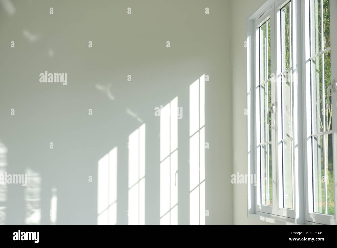 White room, glass windows, combined with the sun lights on the wall ...