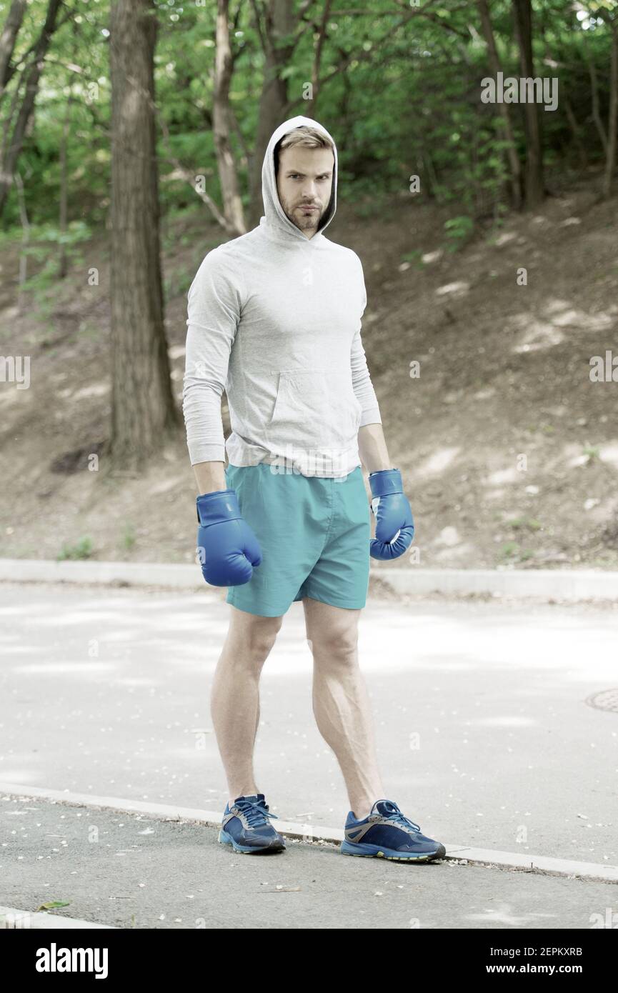 Big day is coming. Man athlete on concentrated face with sport gloves ...