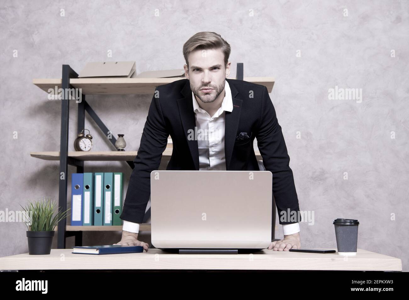 Firing employees. Serious boss picky looking at camera. Boss with ...