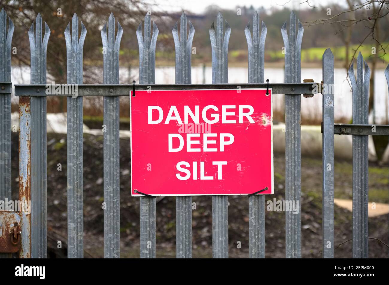 Danger deep silt danger sign on fence at nature reserve Stock Photo - Alamy