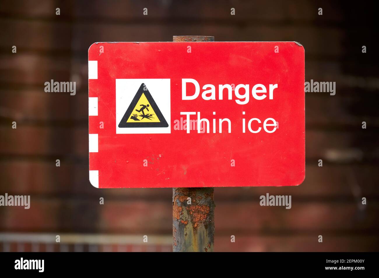 Danger thin ice safety sign at lake in winter Stock Photo - Alamy