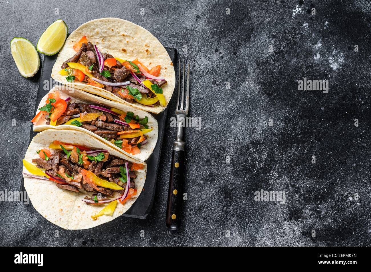Mexican tacos shells with beef meat, onion, tomato and sweet pepper ...