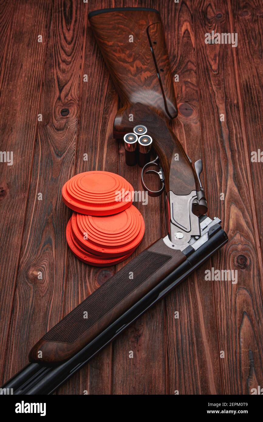 Clay target plates for shooting with rifle on wooden background Stock ...