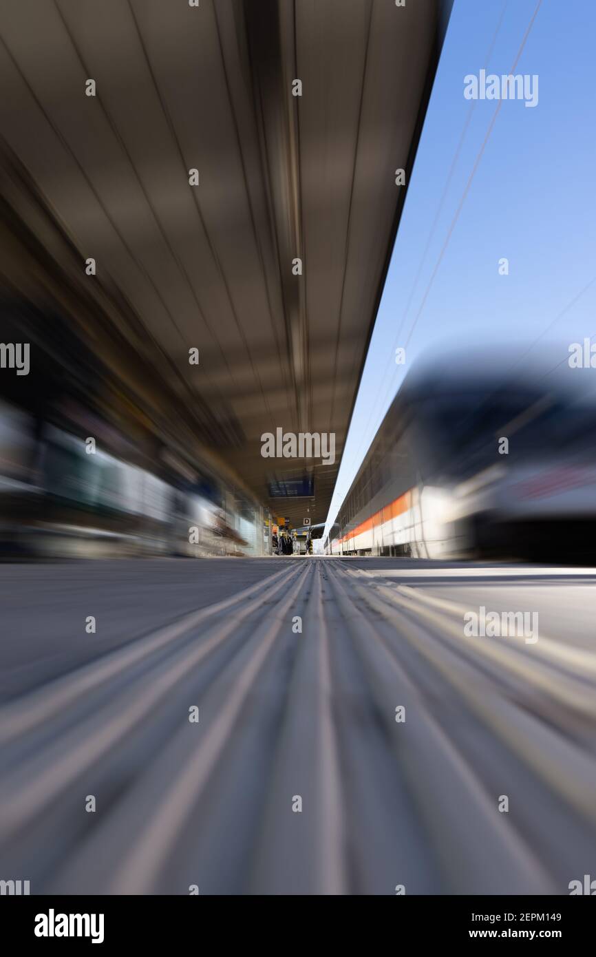 Fast moving train at station. Motion blur Stock Photo - Alamy