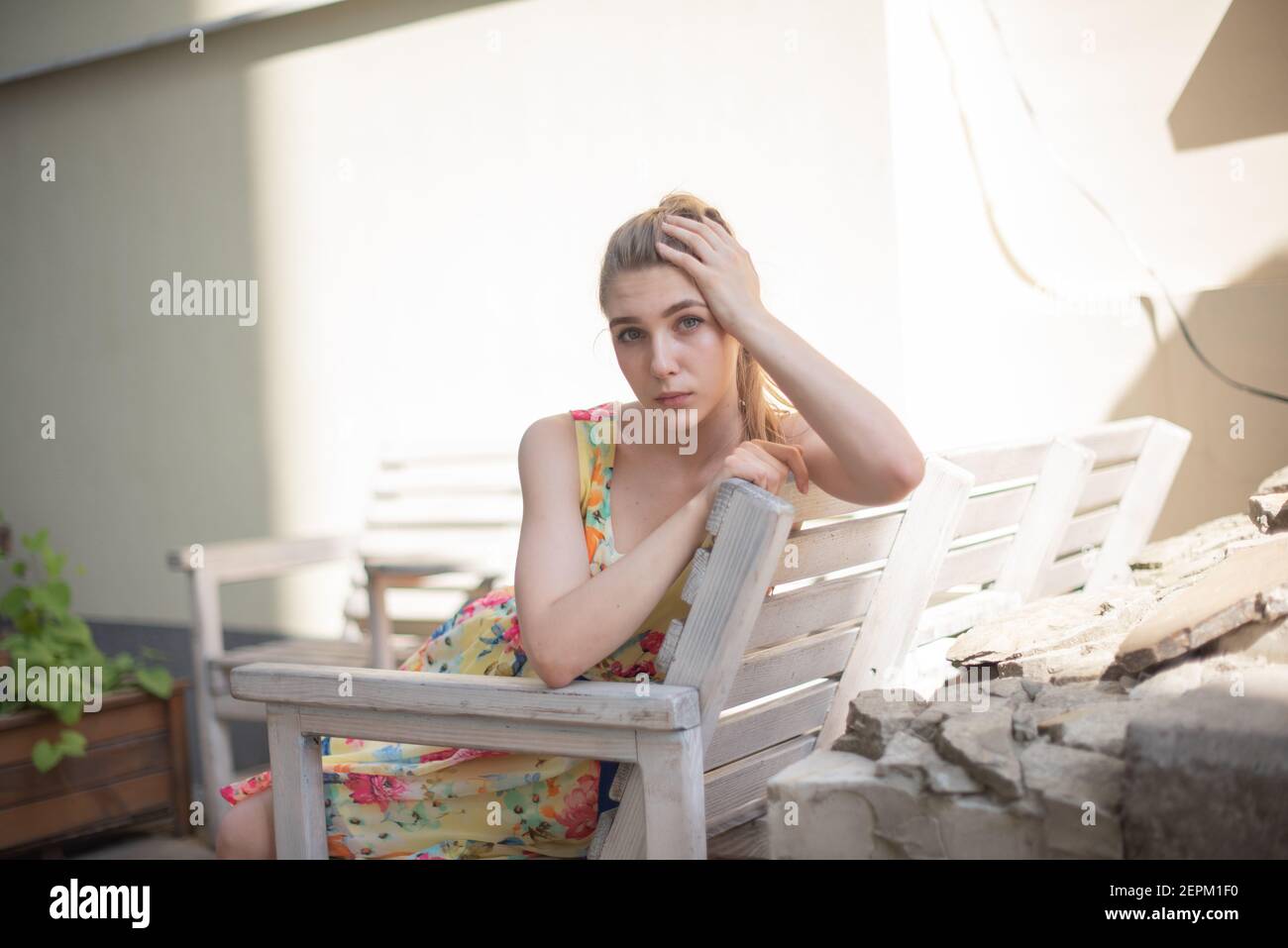 girl in dress walks through the old town in the summer. Beautiful ...
