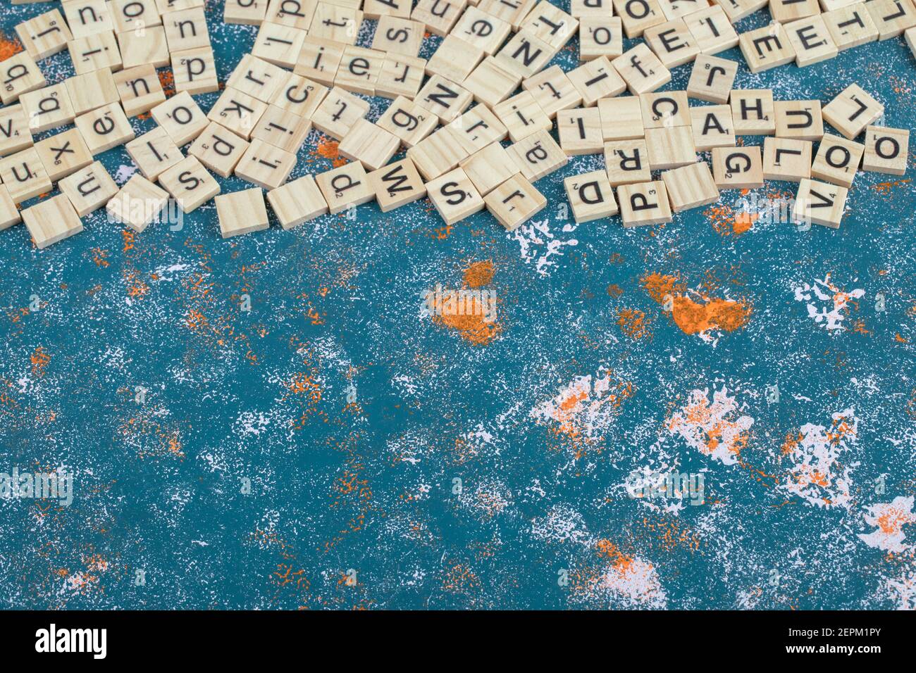 Wooden dice with printed letters on them on blue background Stock Photo ...