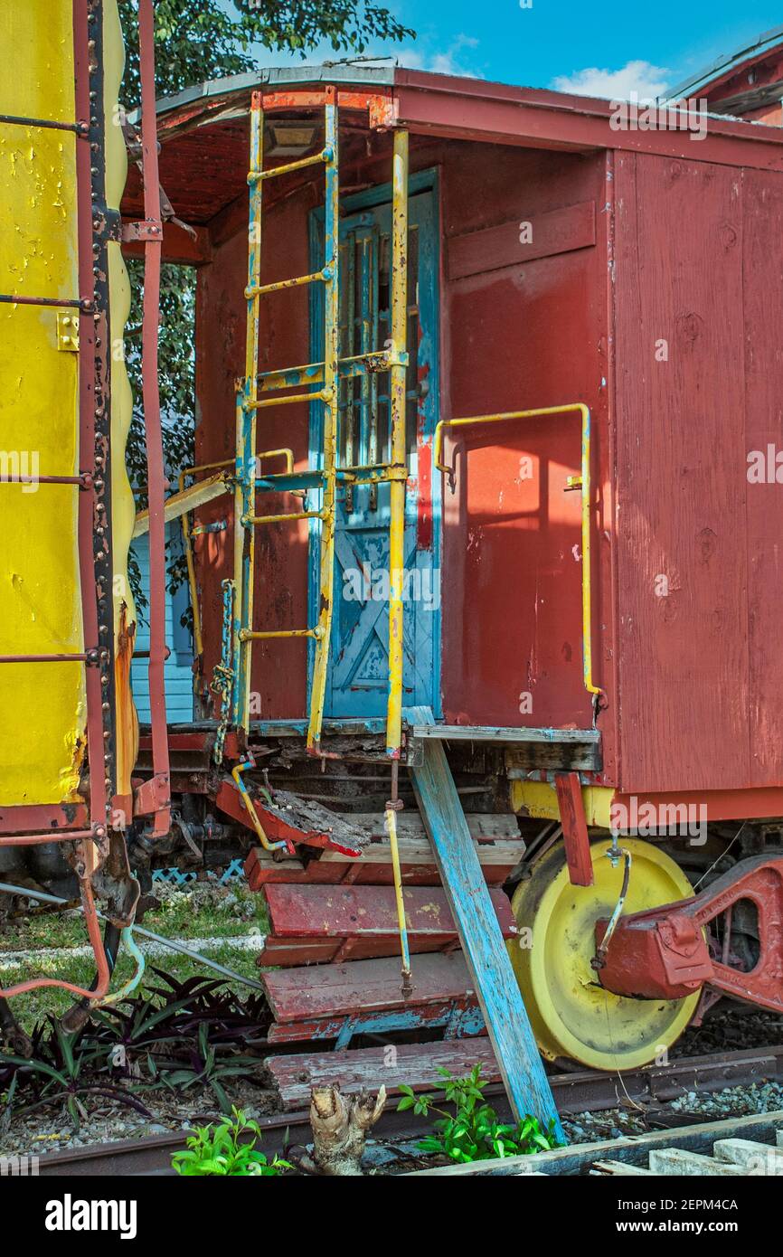 The broken steps on the dilapidated red caboose outside the Cauley ...