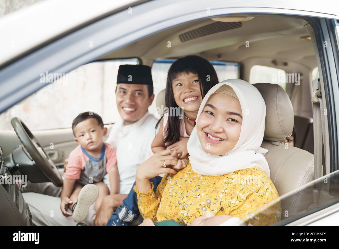 Muslim family travel by car during eid mubarak celebration. asian ...