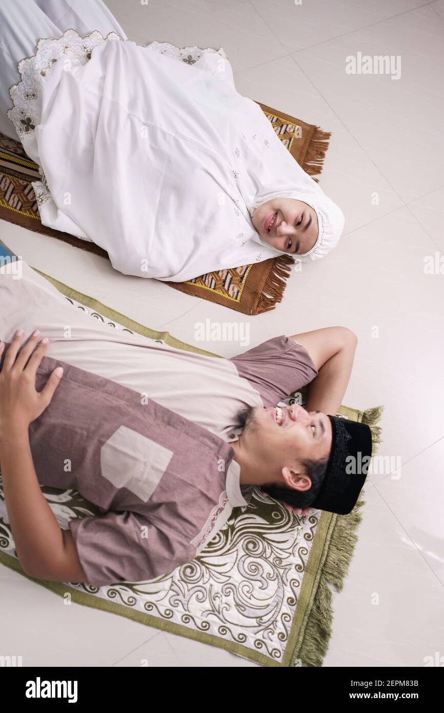 romantic asian muslim couple after praying together at home Stock Photo ...