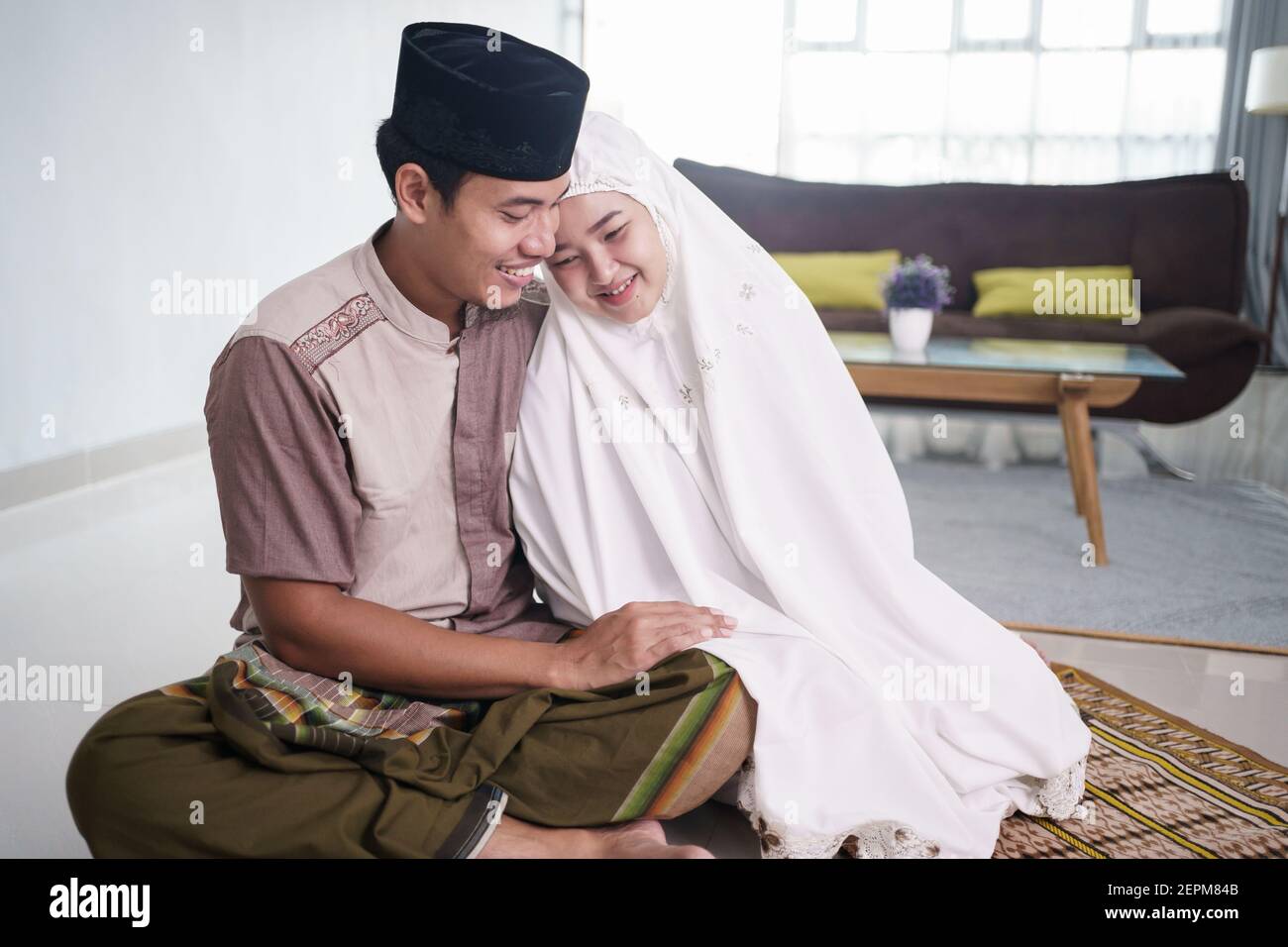 romantic asian muslim couple after praying together at home Stock Photo ...