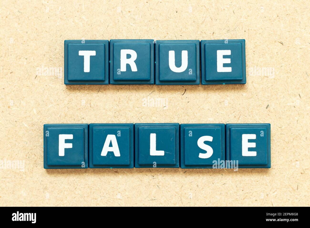 Tile alphabet letter in word ture false on wood background Stock Photo ...