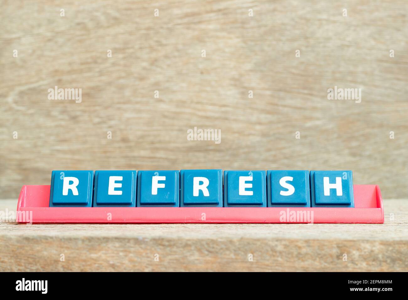 Tile alphabet letter with word refresh in red color rack on wood ...