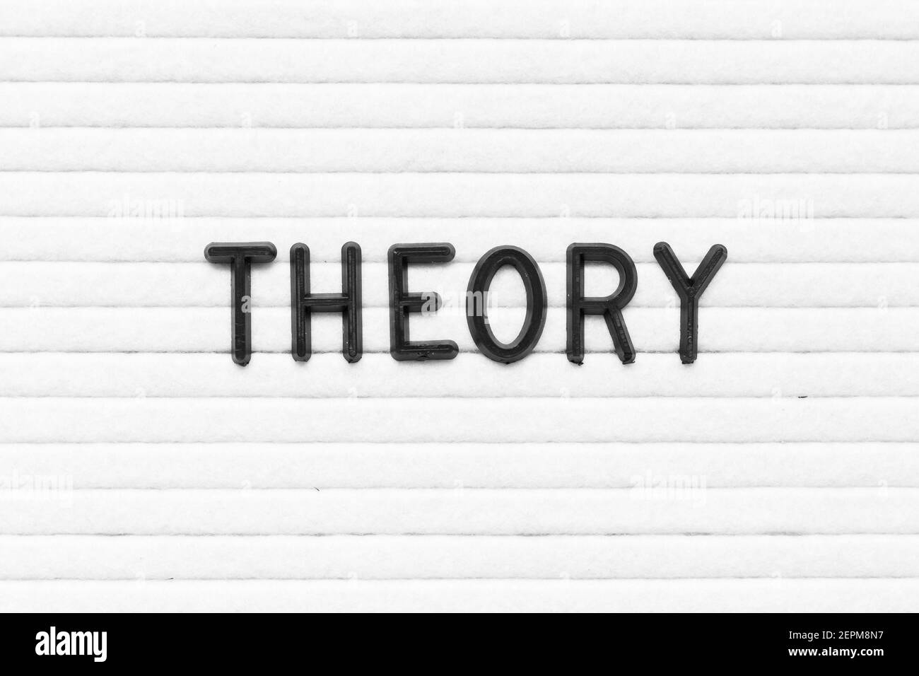 Black color letter in word theory on white felt board background Stock ...