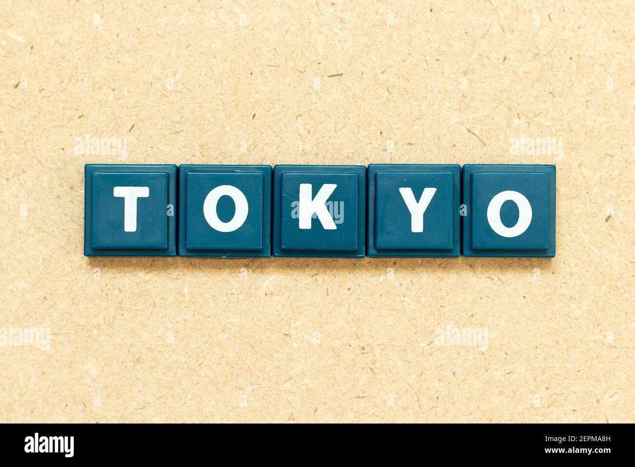 Tile alphabet letter in word tokyo on wood background Stock Photo - Alamy