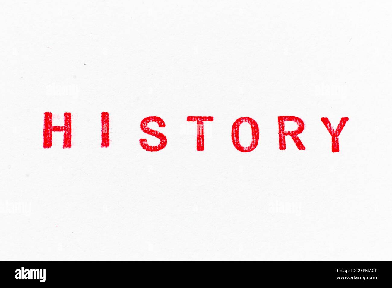 Red color ink rubber stamp in word history on white paper background ...