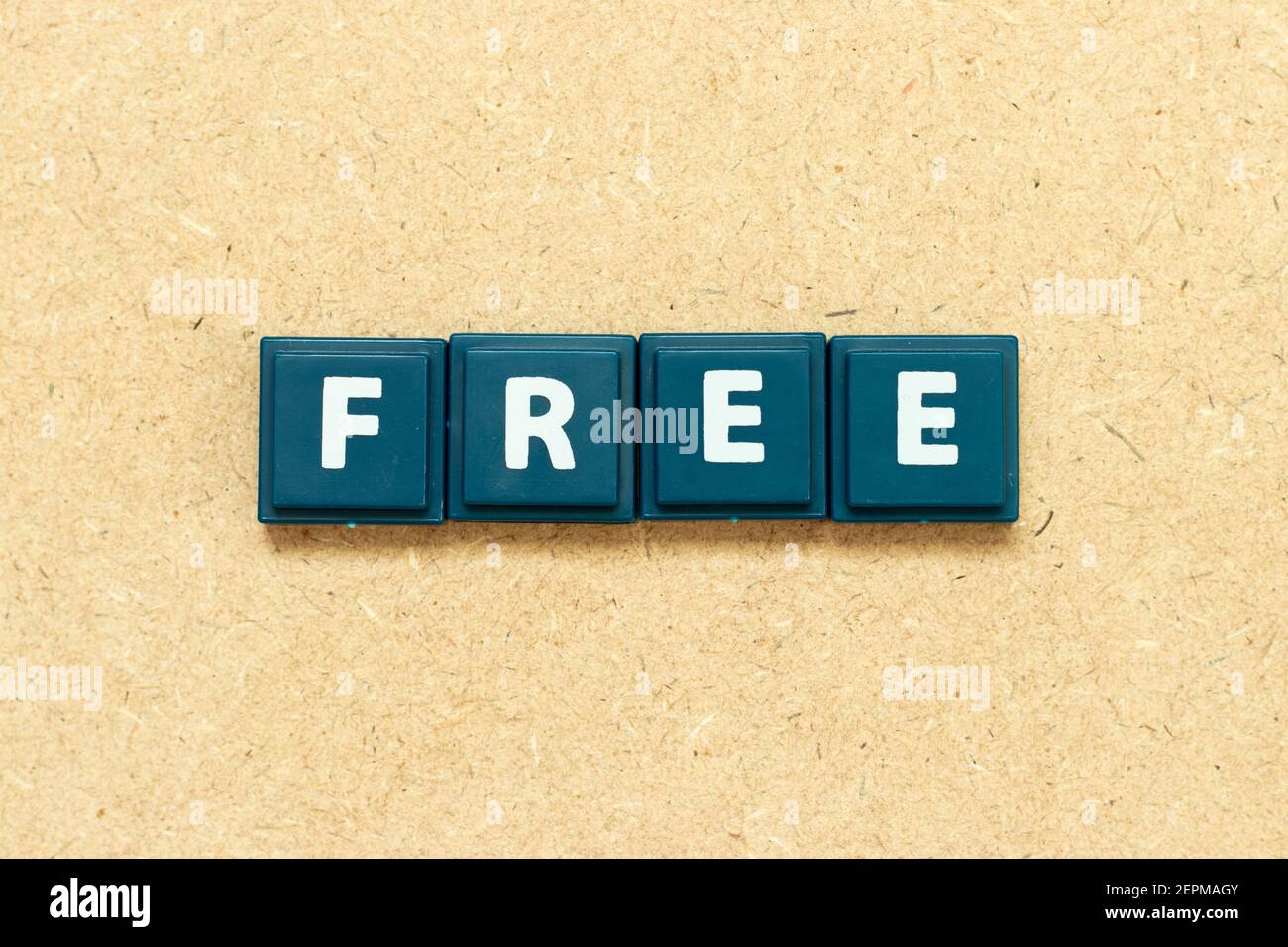 Tile alphabet letter in word free on wood background Stock Photo - Alamy