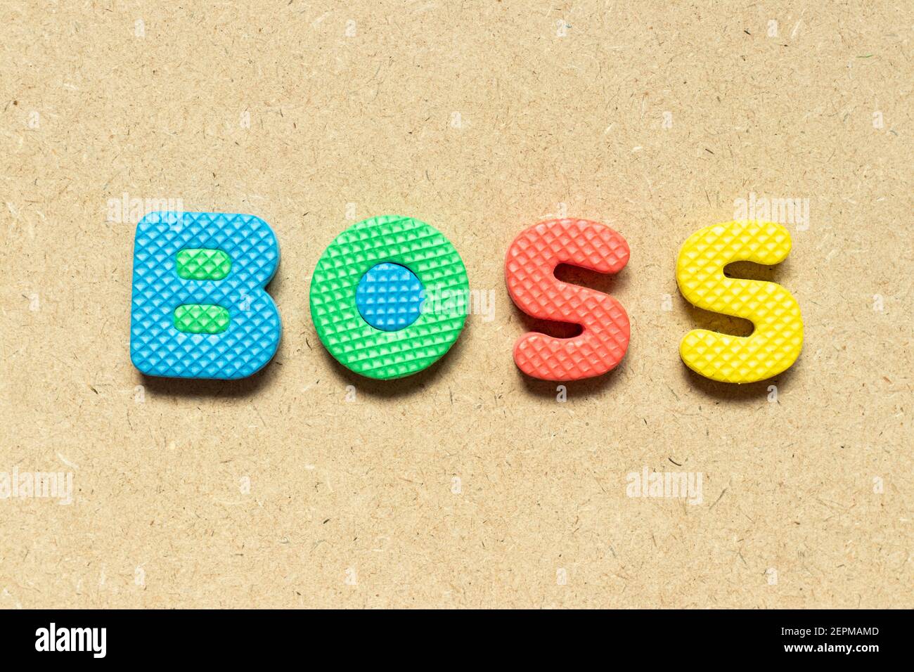 Foam alphabet letter in word boss on wood background Stock Photo - Alamy