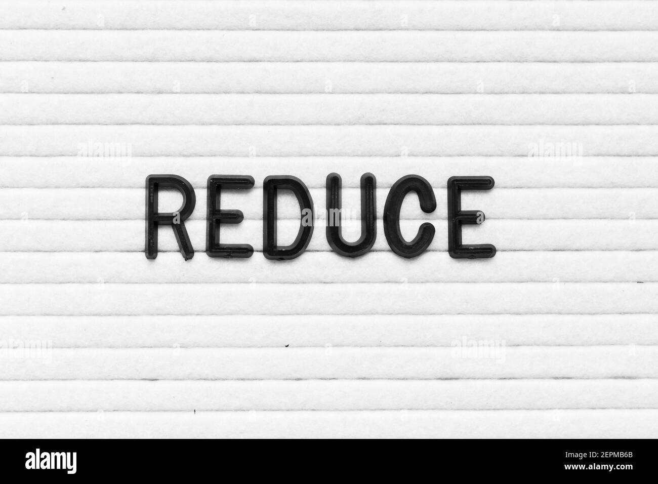 Black color letter in word reduce on white felt board background Stock ...