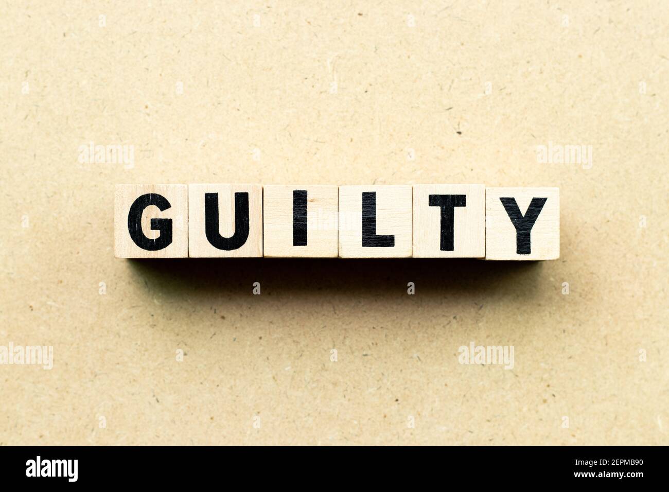Alphabet letter block in word guilty on wood background Stock Photo - Alamy