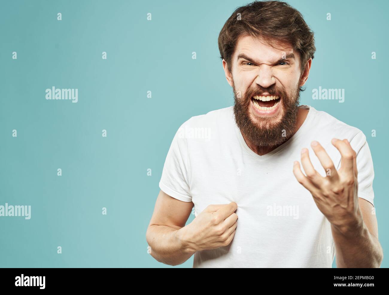 Aggressive man emotions and stress irritability blue background Stock ...