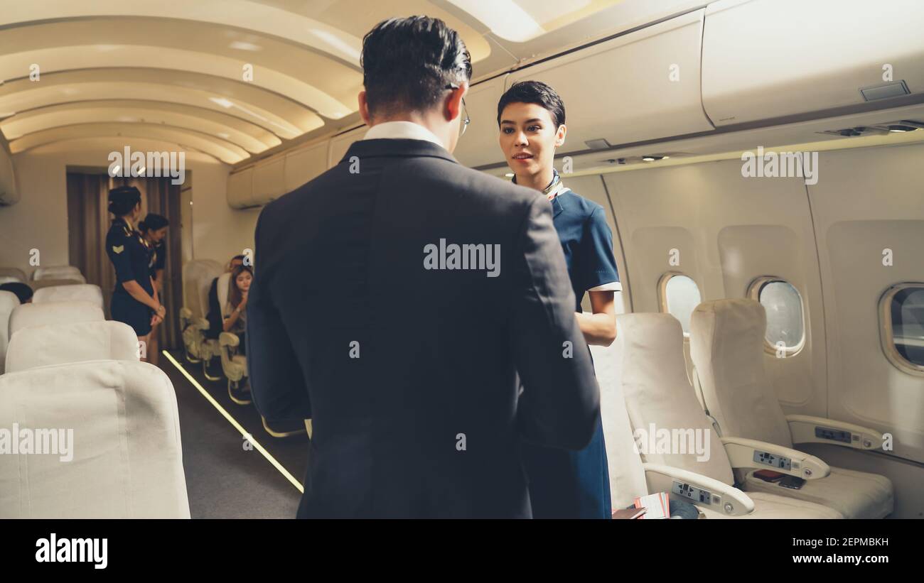 Flight attendant greeting passenger hi-res stock photography and images ...