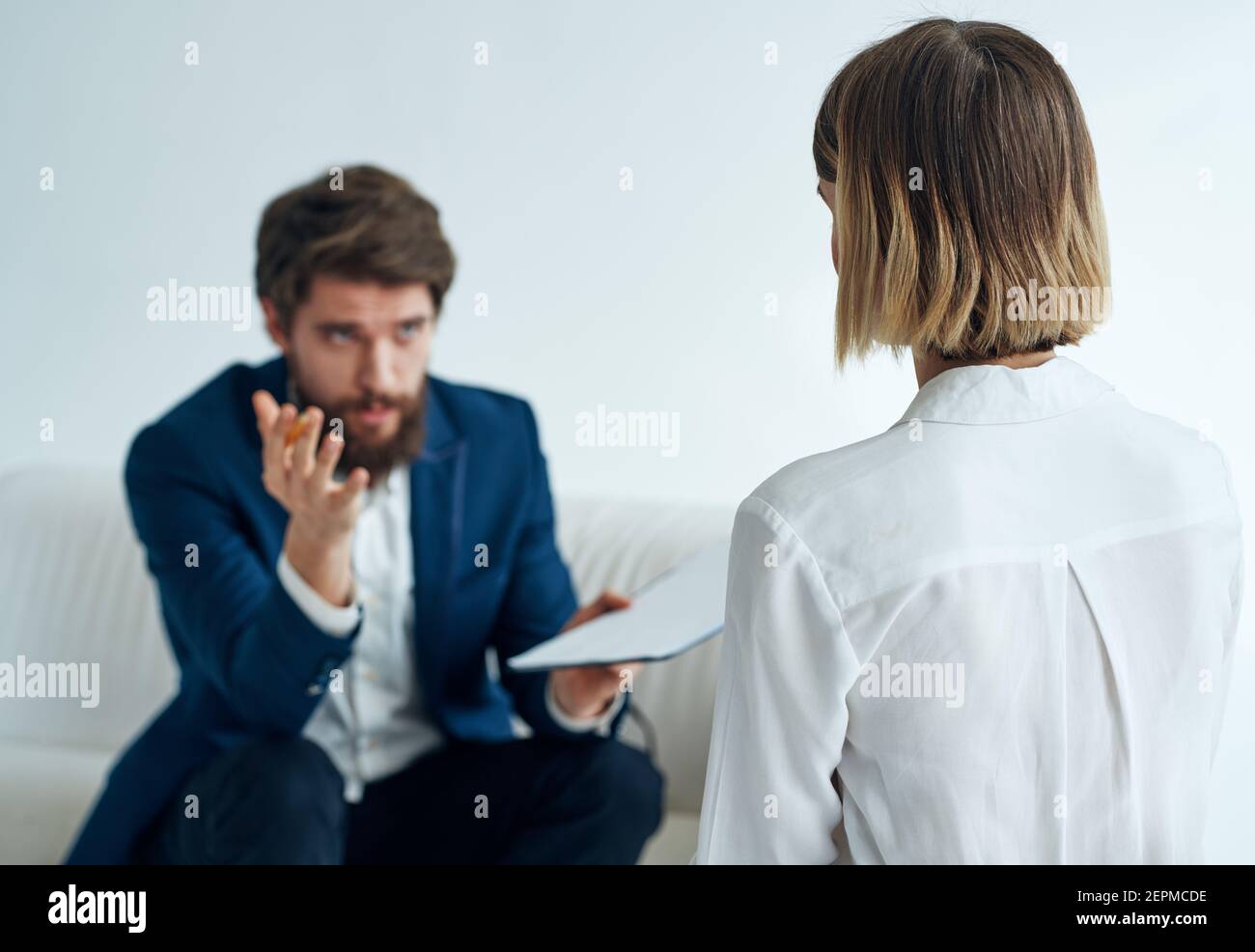 Men and women in suits of colleagues at work office communicating Stock ...